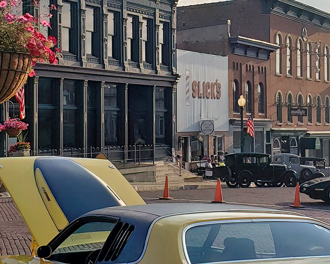 Vintage cars parked along historic storefronts create an accidental time capsule &ndash; "Back to the Future" without the DeLorean.