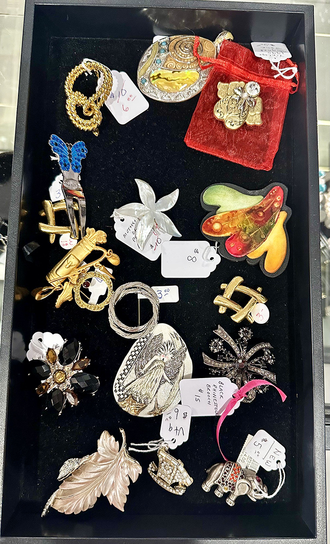 Treasure chest of vintage pins and brooches&mdash;each tiny masterpiece waiting to transform a simple outfit into a conversation starter.