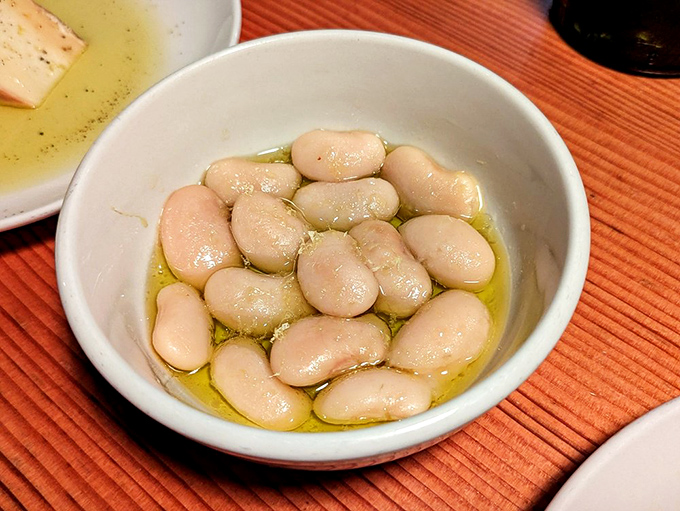 White beans bathing in olive oil&mdash;simple, elegant, and somehow more profound than beans have any right to be.