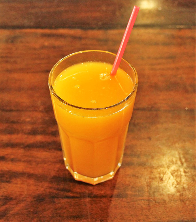 Fresh-squeezed orange juice so bright and cheerful, it practically radiates California sunshine in a glass.