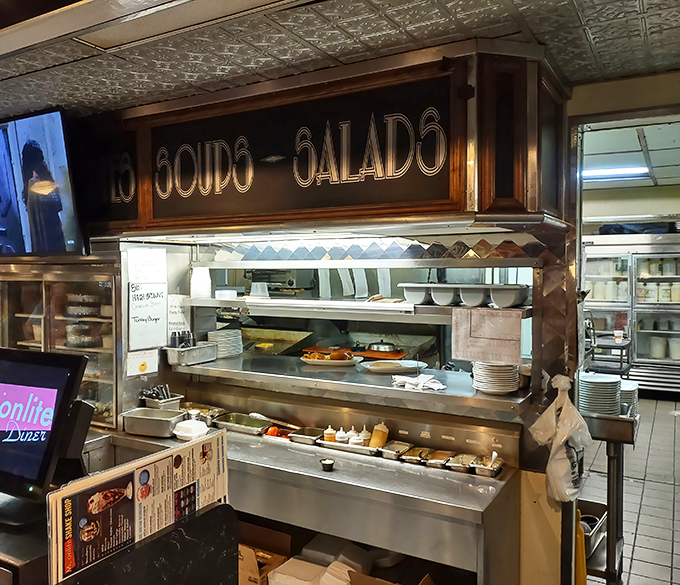 The "Soups-Salads" station isn't just a kitchen area&mdash;it's command central for comfort food operations that run with military precision.