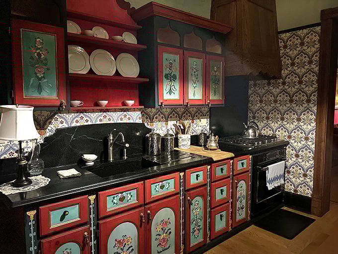 The kitchen's hand-painted cabinetry and patterned tile work showcase craftsmanship from an era when homes were built to outlast their inhabitants – sometimes by centuries.