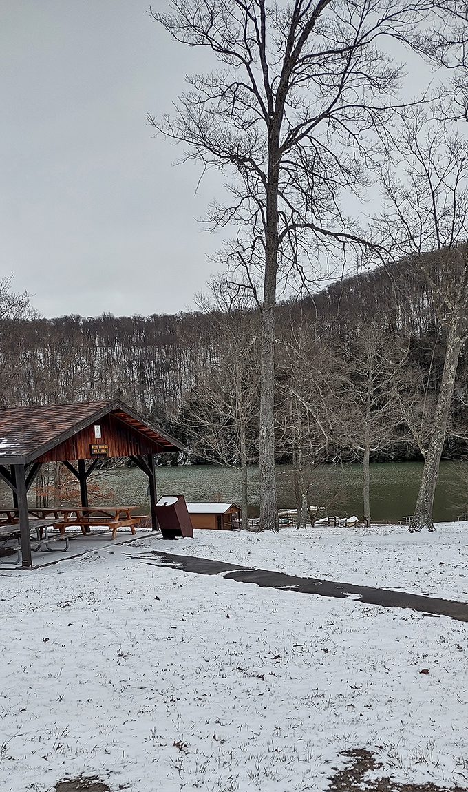 Even in winter's embrace, the lake maintains its serene beauty, like a movie set waiting for its summer actors to return.