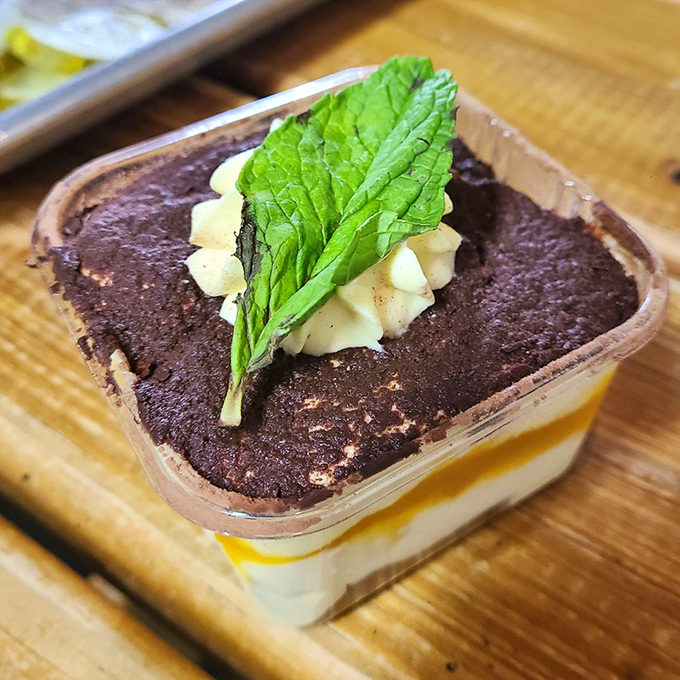 This tiramisu traded Italian espresso for tropical mango, creating a dessert identity crisis so delicious you'll want to encourage its confusion.