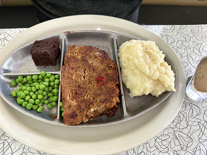 Meatloaf that would make mom nervous about her family recipe. Served on a classic diner plate with sides that know their supporting role.