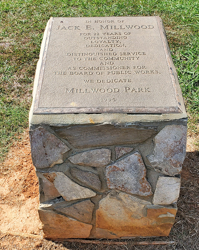 A memorial plaque honors Jack E. Millwood, whose community service helped create this park. Every great peach needs solid roots.