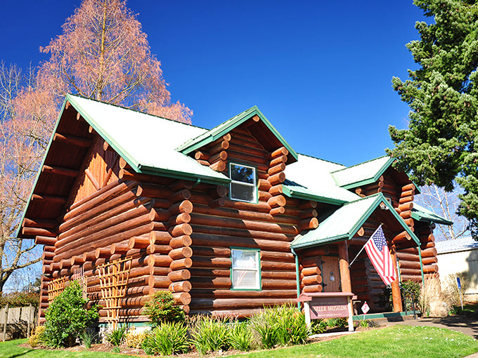 This stunning log cabin museum looks like it was teleported straight from a pioneer postcard &ndash; American flag included, no Instagram filter needed.