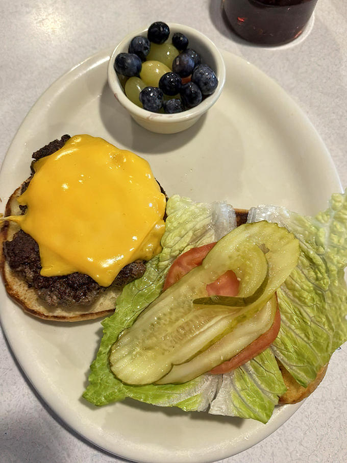 This burger might be small in stature but it's mighty in flavor. The fresh fruit cup provides the illusion of virtue.