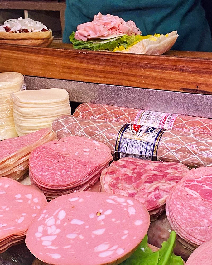 The deli case&mdash;where dreams and lunch plans collide. Each slice of mortadella and provolone is a stepping stone to sandwich enlightenment.