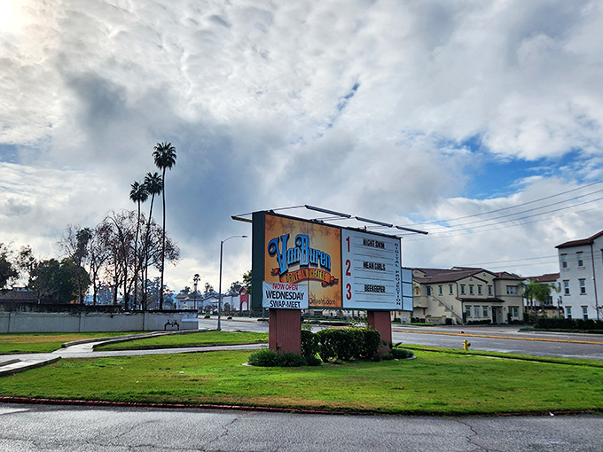 The roadside marquee announces coming attractions, a colorful beacon promising entertainment that doesn't require a password or profile setup.