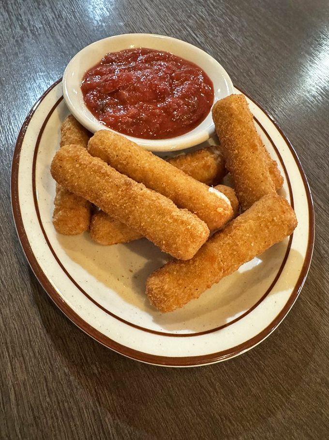 Golden mozzarella sticks with marinara – because sometimes the perfect appetizer is just hot cheese wearing a crunchy jacket, ready for its sauce bath.