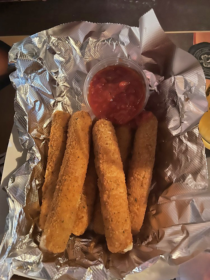 Mozzarella sticks: the universal language of bar food done right. Crispy exterior, gooey interior, marinara for dunking&mdash;some traditions need no updating.