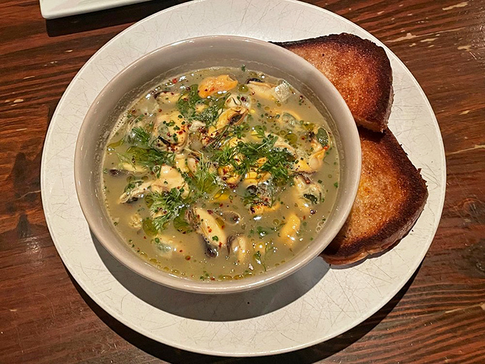 These mussels aren't just swimming in broth&mdash;they're doing the backstroke through a sea of herbs and butter that deserves its own Olympic medal.