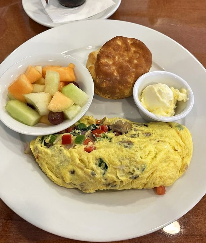 This isn't just an omelet &ndash; it's a morning masterpiece filled with fresh vegetables and served with fruit and a biscuit that could make a Southerner weep with joy.