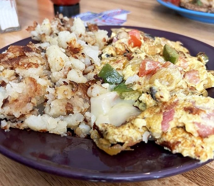 An omelet that actually contains its fillings instead of losing them on the plate&mdash;a small miracle in the breakfast universe.