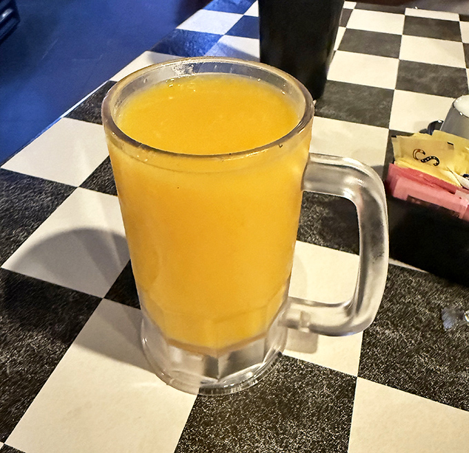 That orange juice looks fresh-squeezed and Florida-bright, served in a frosty mug that keeps it cold while you contemplate your next breakfast move.