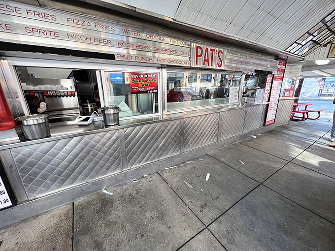 The hallowed window where dreams become reality. Notice the stainless steel shine&mdash;that's the gleam of decades of sandwich perfection.