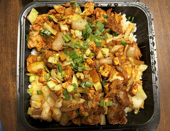 A riot of color and texture, the oseng-oseng chicken proves that sometimes the most unassuming dishes deliver the most memorable flavors.