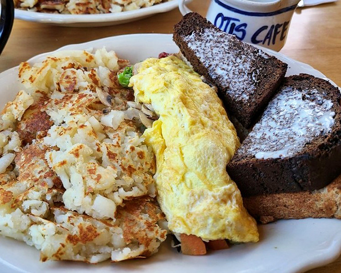 An omelet so generous it could feed a small village, stuffed with morning magic ingredients.