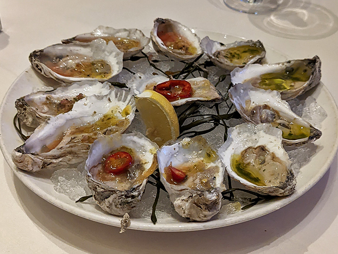 Oysters on the half shell, glistening like jewels on ice. Nature's perfect appetizer, requiring nothing more than a squeeze of lemon and good company.