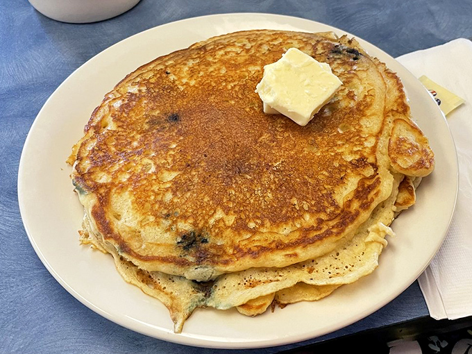Pancakes so perfectly golden they belong in Fort Knox. That pat of butter slowly melting into a pool of breakfast bliss.