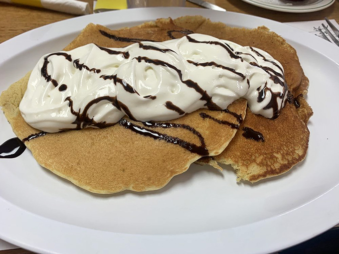Pancakes that don't need to be photographed to be memorable&mdash;they just need to be eaten. That whipped cream and chocolate drizzle is the breakfast equivalent of a standing ovation.