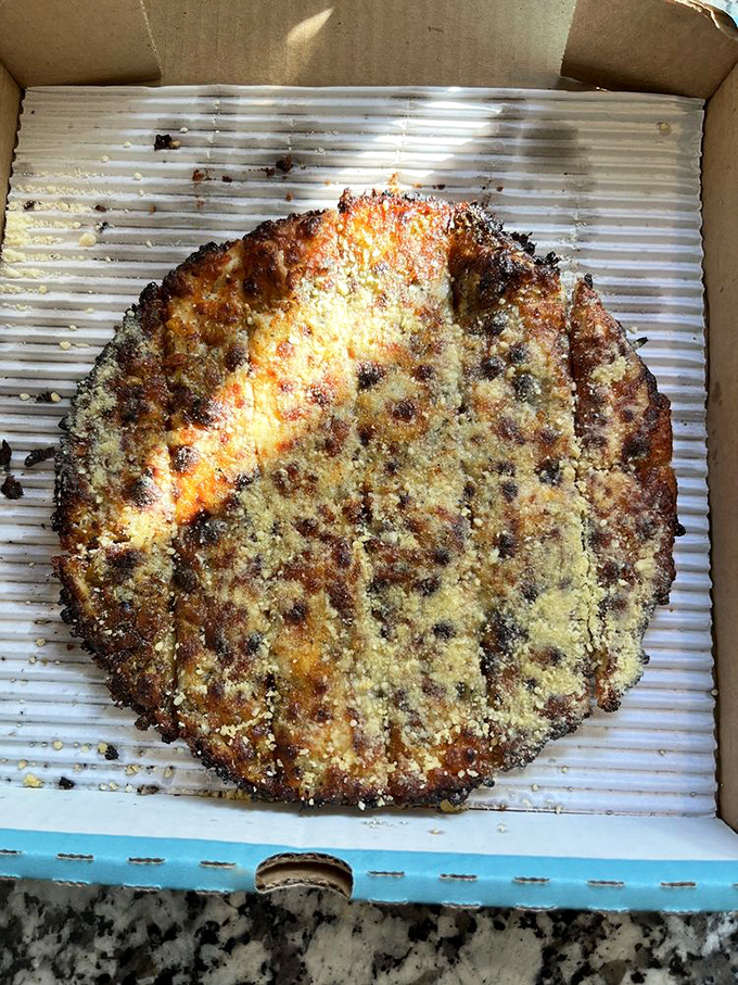 This Parmesan-dusted masterpiece has edges so perfectly caramelized, they deserve their own fan club. Cheese crust nirvana achieved.