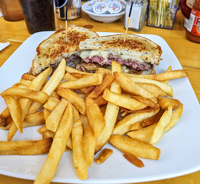 This patty melt doesn't just satisfy hunger&mdash;it negotiates peace treaties between warring taste buds with diplomatic grilled onions.