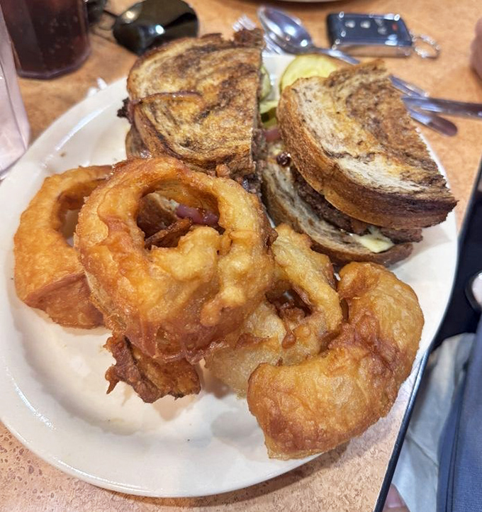 A patty melt and onion rings that would make your cardiologist wince and your taste buds sing. Some pleasures are worth every delicious minute.