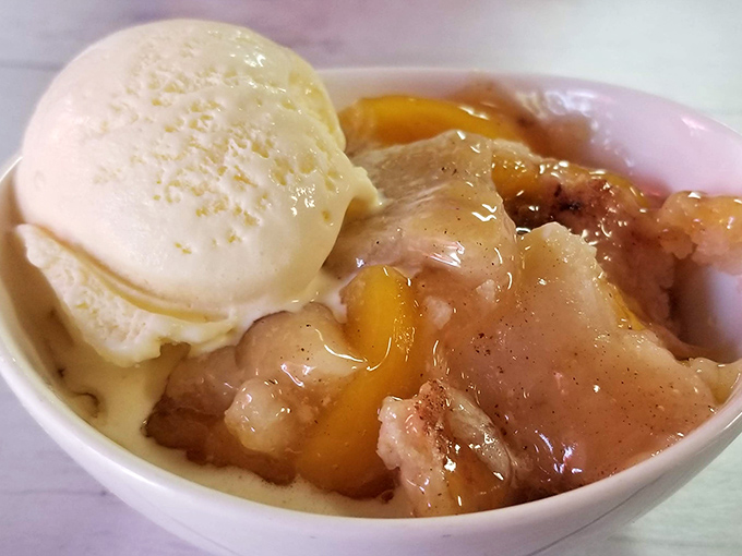 Peach cobbler that doesn't just satisfy your sweet tooth&mdash;it tells it to sit down and stay awhile. That scoop of vanilla? Non-negotiable.