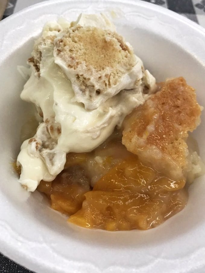Peach cobbler that strikes the perfect balance between fruit and buttery crust, crowned with ice cream melting into warm peachy goodness.