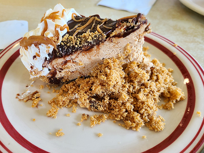 Peanut butter pie with chocolate drizzle and crumb topping&mdash;proof that sometimes the best things in life require absolutely no justification whatsoever.