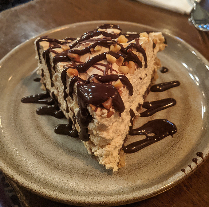 A slice of peanut butter pie that makes you question why you ever waste calories on lesser desserts.