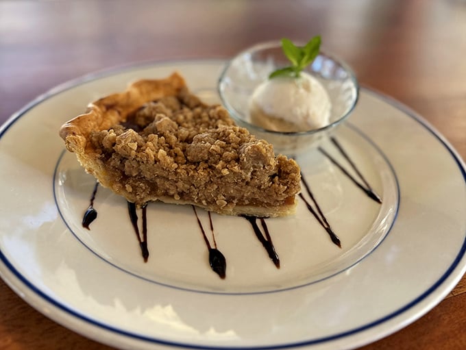 A slice of pecan pie that would make your grandmother simultaneously proud and jealous. That scoop of vanilla ice cream is the cool companion to warm, nutty decadence.