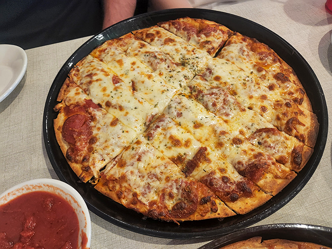 This isn't just any pepperoni pizza—it's the kind that makes you question why you ever order anything else. Simple perfection on a pan.