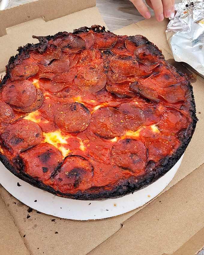 This pepperoni pizza isn't just food, it's performance art. The crispy-edged pepperoni and that legendary blackened crust deserve a standing ovation.