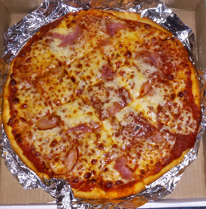 A ham and cheese pizza that doesn't need to name-drop European regions to prove its worth. Simple, satisfying, and exactly what you want after a long day.