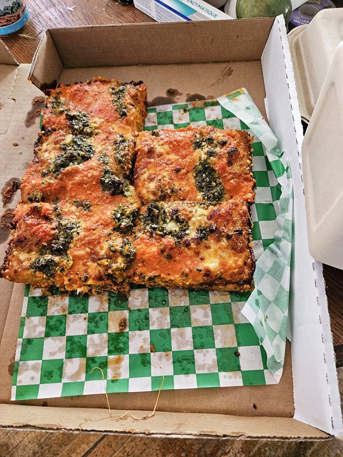 Red sauce and pesto join forces on this rectangular masterpiece&mdash;proof that world peace might be possible if we all just shared more pizza.