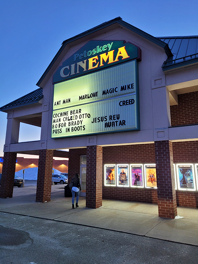The Petoskey Cinema marquee glows with promise, offering small-town movie magic without big-city ticket prices.