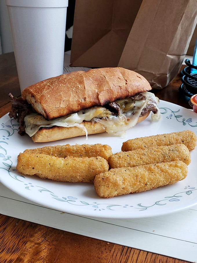 The Philly cheesesteak, served with a side of mozzarella sticks, proves that Frannie's respects traditions from across state lines while adding their own Midwestern magic.