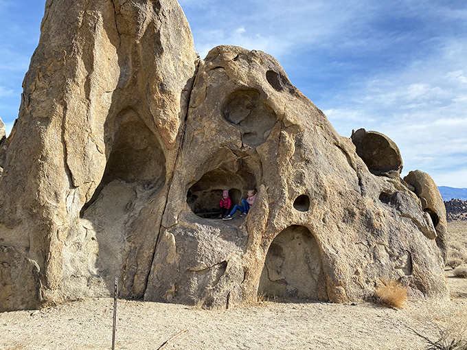 Nature's own hide-and-seek playground where these weathered rock windows frame perfect peekaboo moments for adventurous spirits.