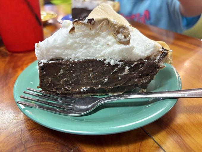 A slice of chocolate cream pie with mile-high meringue that defies both gravity and restraint. Save room for dessert&mdash;or start with it!