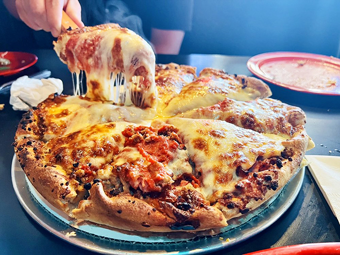 Cheese pulls that deserve their own slow-motion sequence. This pizza isn't just food—it's performance art with pepperoni.