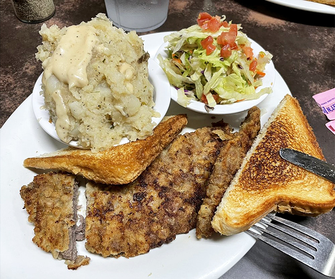 A country-style platter that doesn't mess around &ndash; tender meat, gravy-topped potatoes, and a salad that's there to make you feel slightly virtuous.