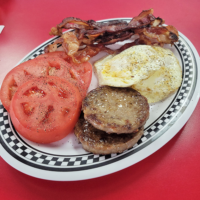 The breakfast platter that answers the eternal question: "Why choose between bacon, eggs, sausage and tomato when you can have it all?"