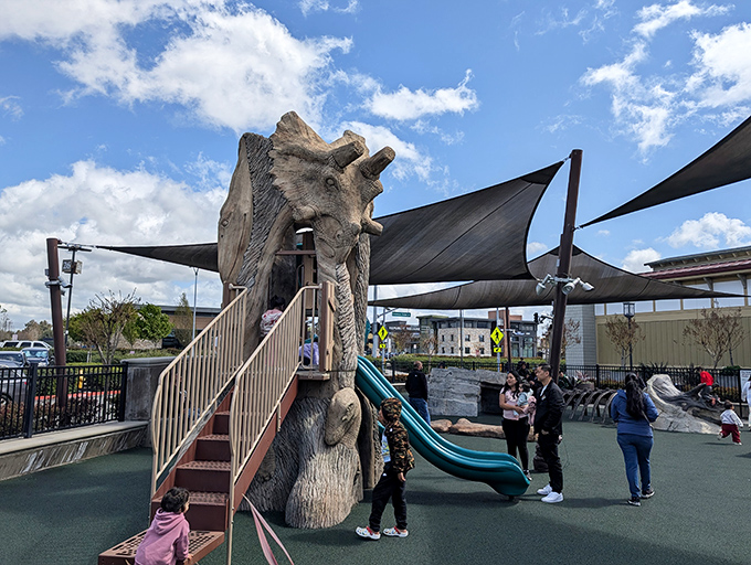 The children's playground: retail genius at work. Happy kids mean parents can shop longer, proving that outlet designers understand the economics of family shopping.