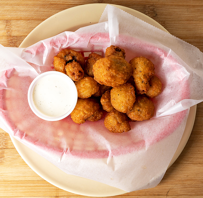 These golden hush puppies aren't just fried&mdash;they're little orbs of cornmeal joy that somehow taste like childhood and comfort all at once.