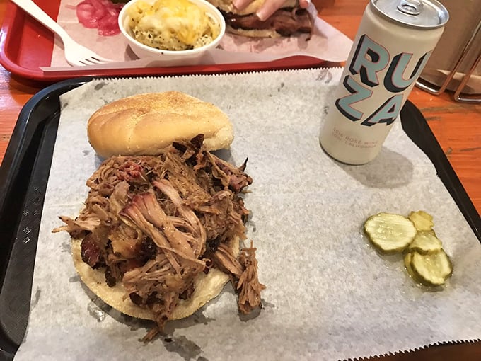 The open-faced pulled pork sandwich: when you're too excited about the meat to bother with closing your sandwich. Those pickle chips aren't just watching&mdash;they're waiting. 