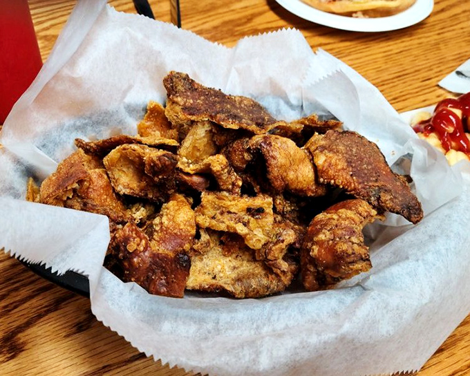 Crackling pork skins that shatter like delicious glass with each bite. The ultimate Southern snack that demands your full attention.