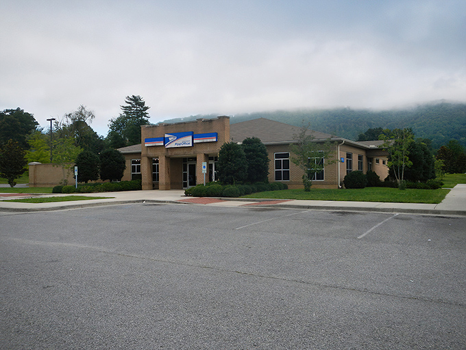 This modern municipal building stands ready to serve residents, with misty mountains creating a dramatic backdrop for everyday civic business.